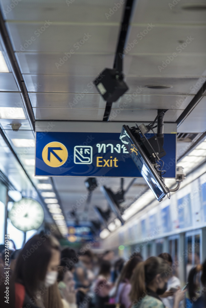 Crowd of People in a Busy Subway Station with Clear Exit Sign metro ...