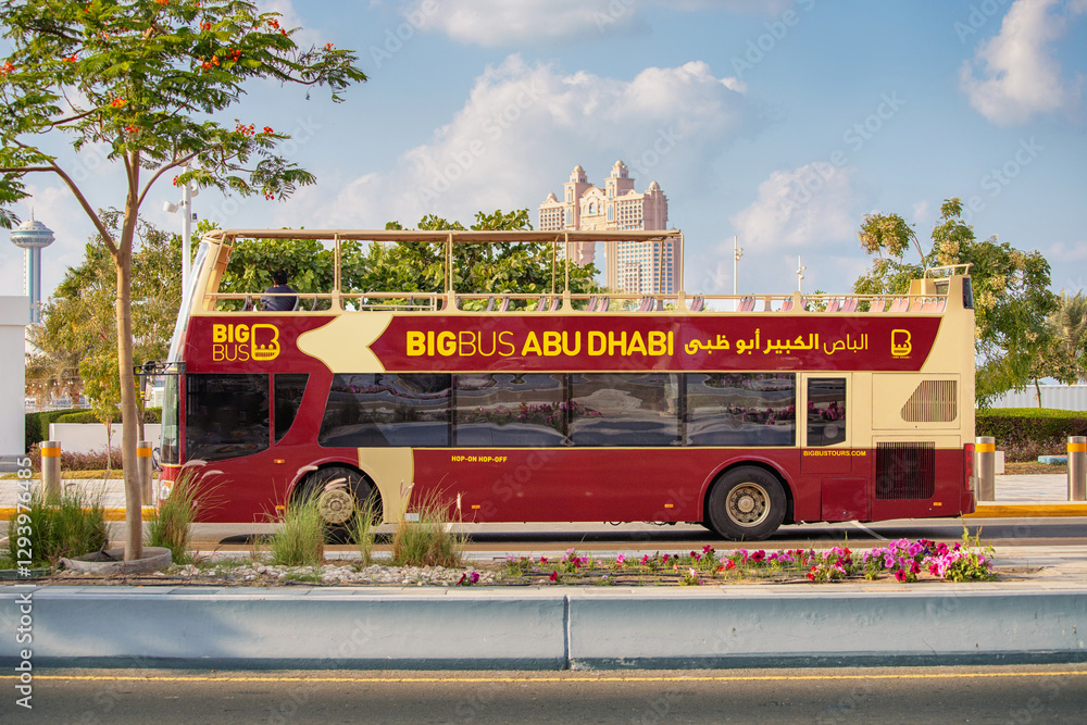 19 January 2025, Abu Dhabi, UAE: Open top tourist Big Bus driving near ...