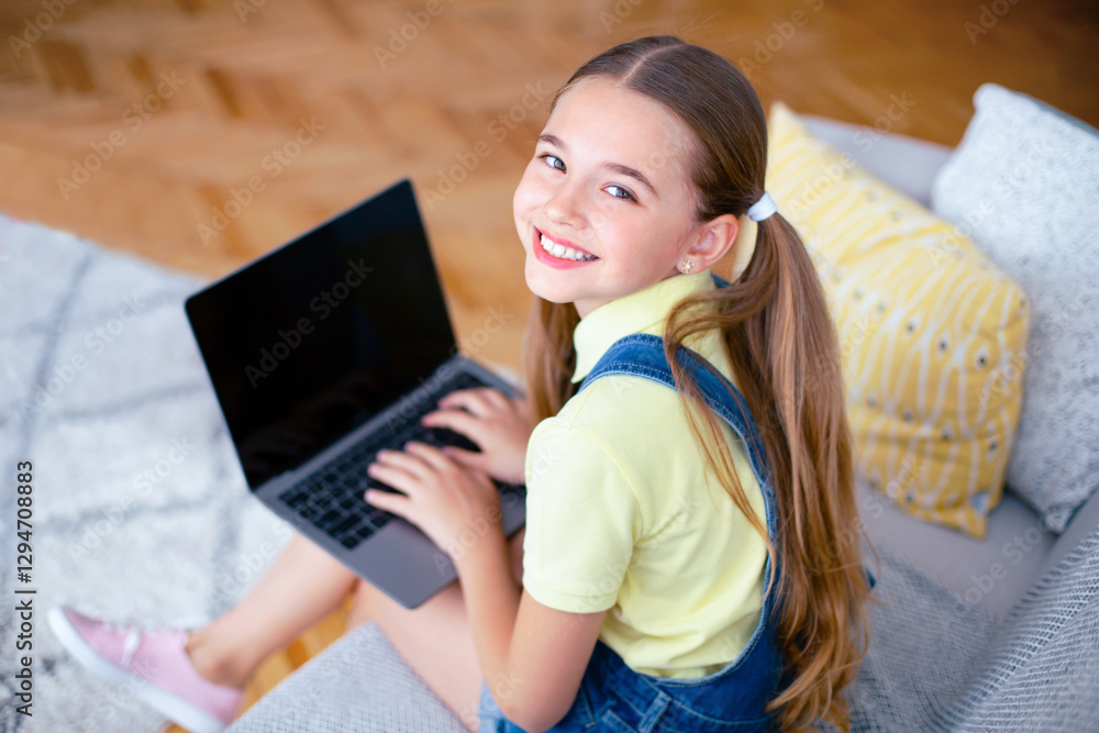 Over the shoulder view closeup portrait of girl using her laptop with ...