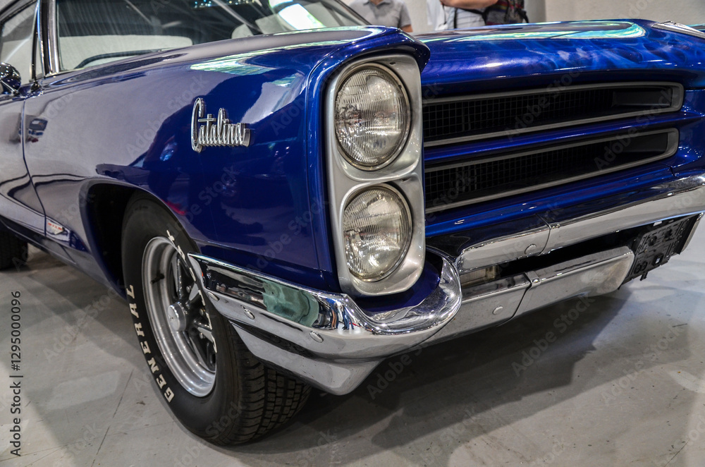 Front end of classic Pontiac Catalina vibrant blue with gleaming chrome ...