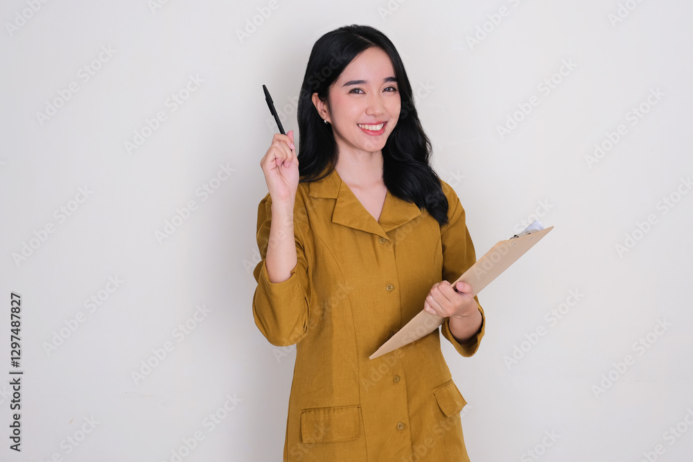 Indonesia government civil staff smiling happy while holding writing pad and pen Stock Photo ...