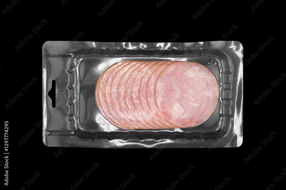 Top view of sliced smoked beef meat in vacuum package isolated on black ...