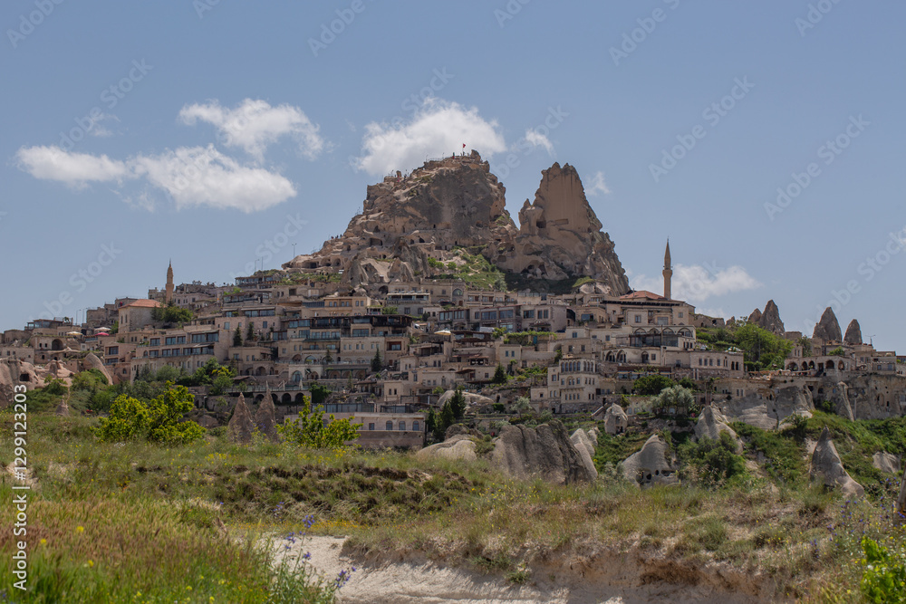 Uçhisar Castle in Cappadocia, Turkey, rises above fairy chimneys and ...