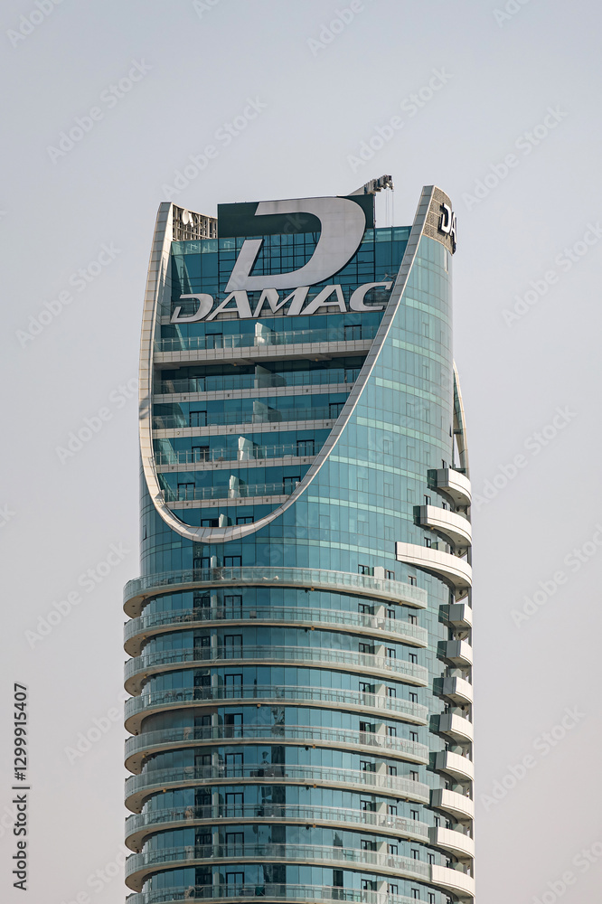 DAMAC Maison Distinction hotel tower. Damac development company logo on ...