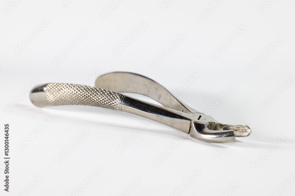Stainless steel pliers for tooth extraction. The forceps in this photo ...