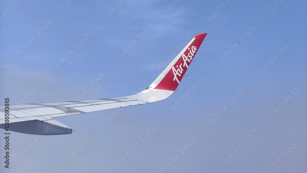 View of an AirAsia Airbus A320 wing from a cabin window in Bangkok ...