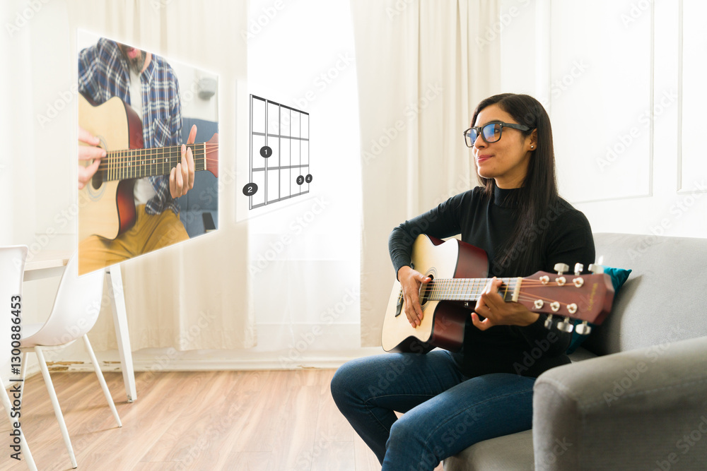 Woman using AR glasses, learning guitar through virtual fretboard ...