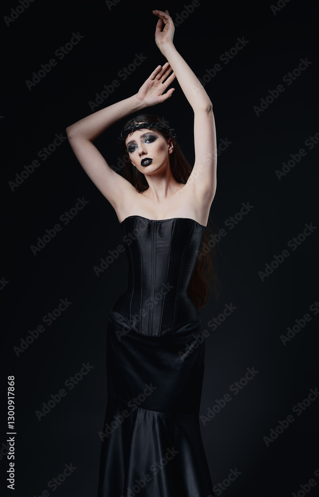 Studio portrait of the beautiful sad goth girl. Attractive informal ...