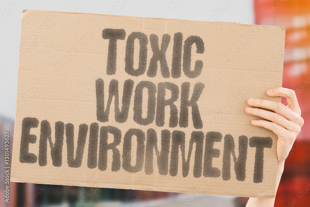 "TOXIC WORK ENVIRONMENT" on a banner highlights workplace struggles ...