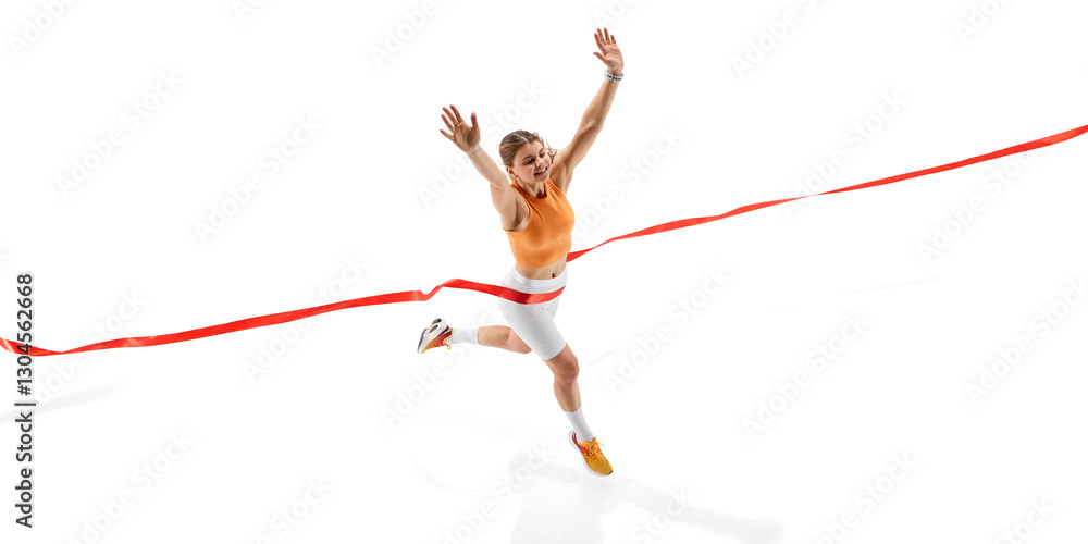 Victorious female sprinter leaping past finish line, arms raised in ...
