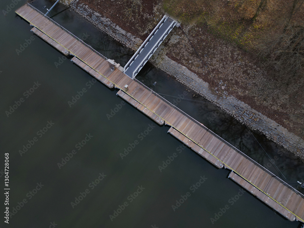 anchoring concrete footings hold the concrete floating pier by the ...