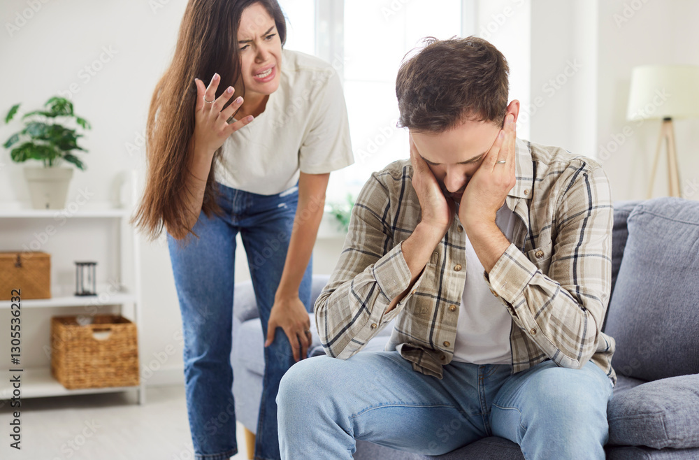 Family couple is having a quarrel at home, with the wife angrily ...
