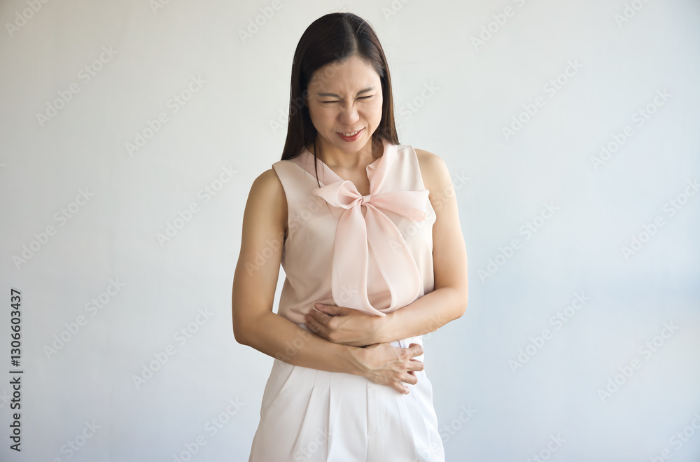 Southeast Asian woman with stomach ache, concept image of menstrual ...