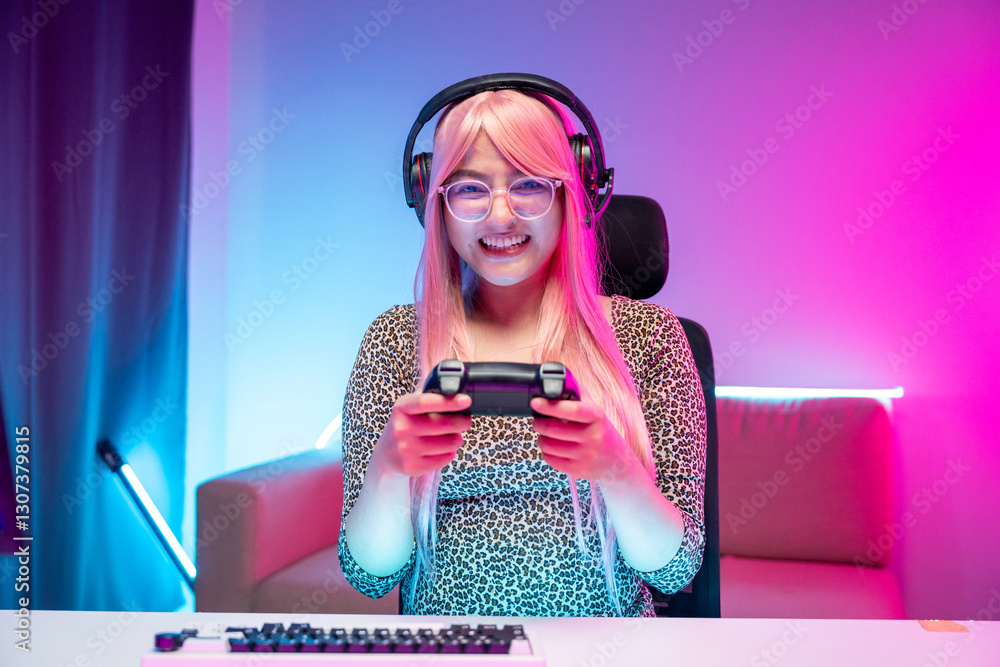 Professional gamer. Young asian pretty woman sitting on chair with ...