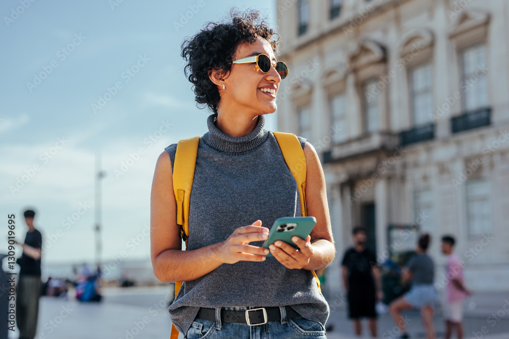 Tourist using smart phone and exploring city during summer vacation ...