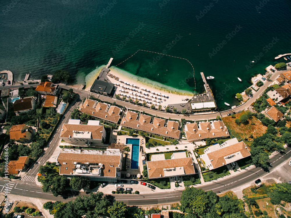 Red roofs of the Huma Kotor Bay hotel and villas with private beach and ...