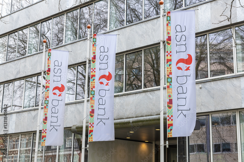 ASN Bank logo on flags at the headquarters building. The Hague, the ...