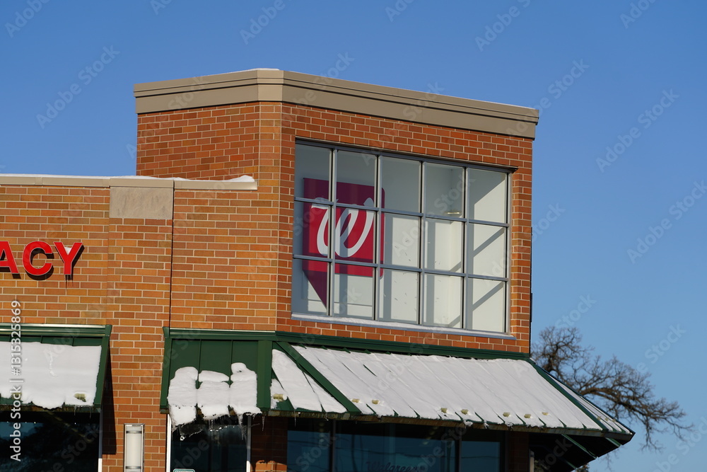Walgreens brand name logo on the side of a building. Stock Photo ...