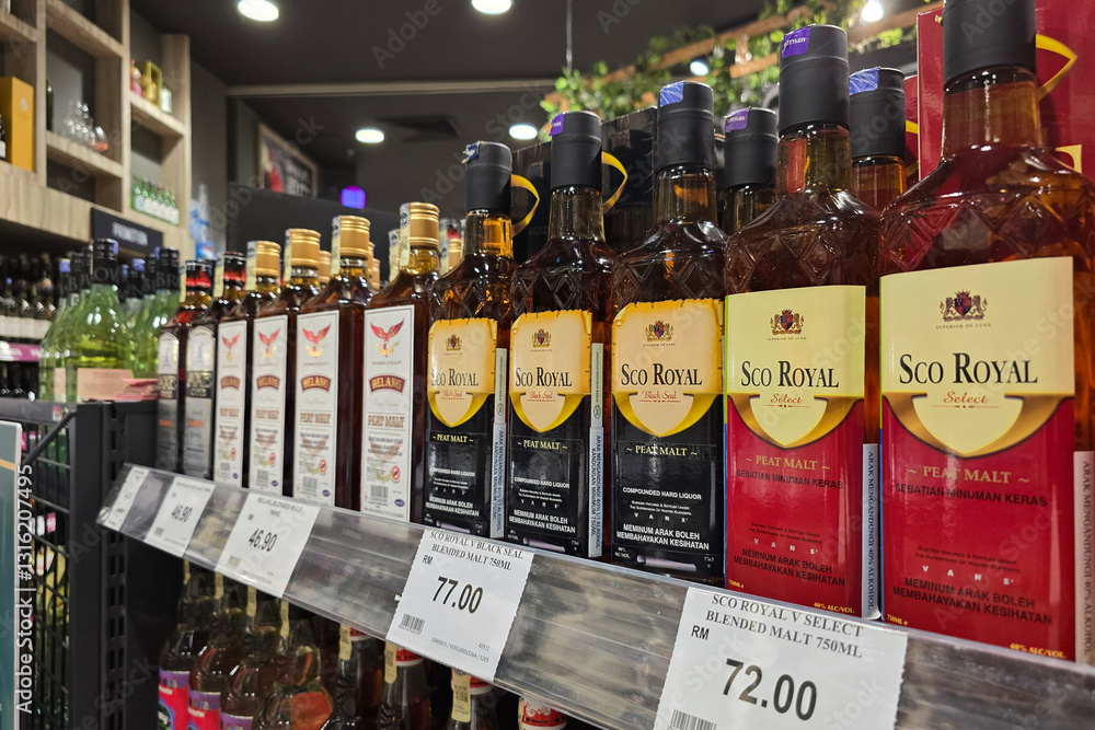 Penang, Malaysia - Mar 1, 2025: A selection of whisky bottles displayed ...