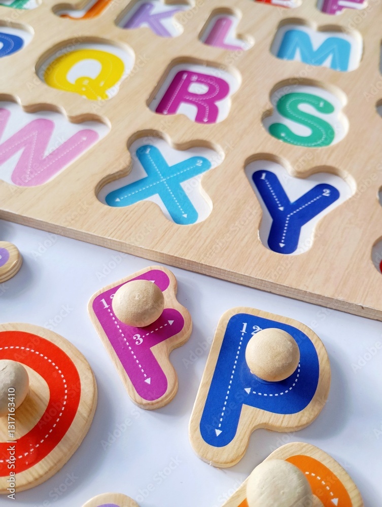 Children's wooden alphabet board. Colourful shape. Educational logic ...