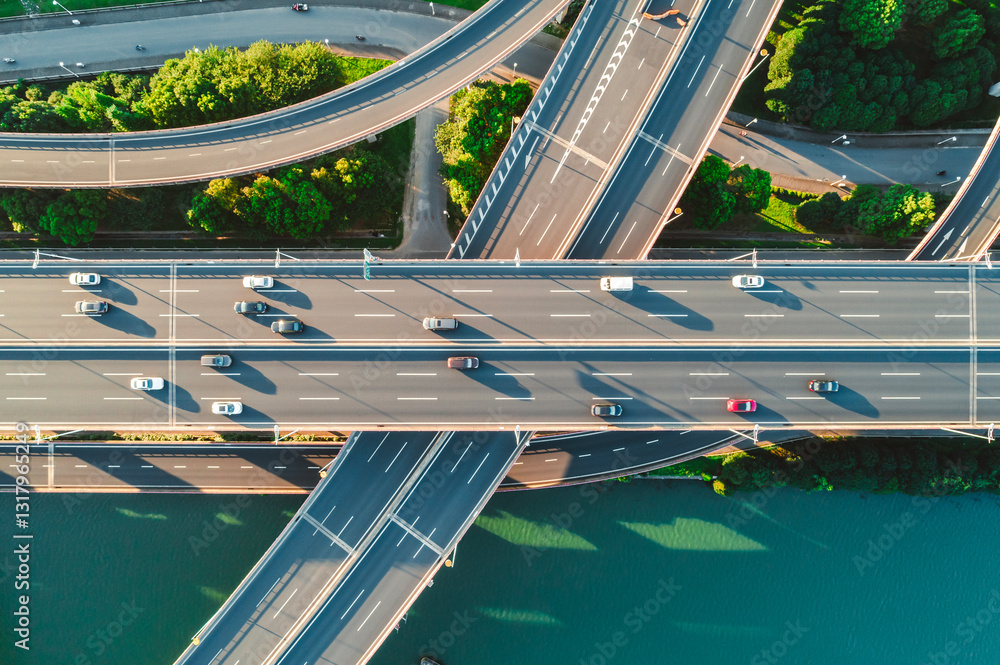 Aerial of vehicles navigate a complex highway system, showcasing ...