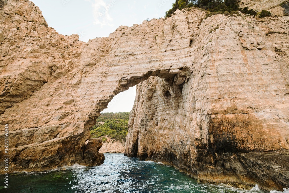 Explore the enchanting arches of Zakynthos, where towering cliffs meet ...