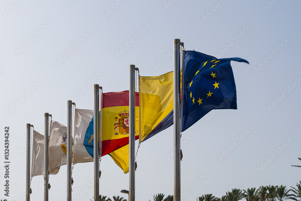 Some flags waving in the wind, symbols of unity, solidarity and harmony ...