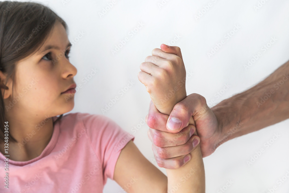 child girl 7-8 years in a pink shirt looking up with concern as an ...