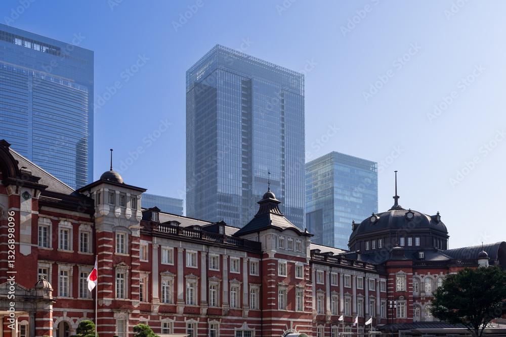 Facade of Tokyo Station with its domed rooftops and intricate detailing ...