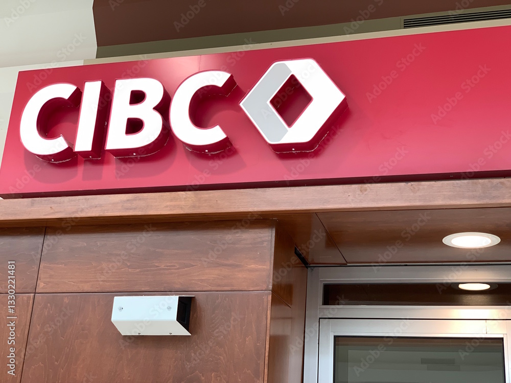 Ottawa, ON-February 24,2025: A CIBC branch prominent CIBC logo with its ...