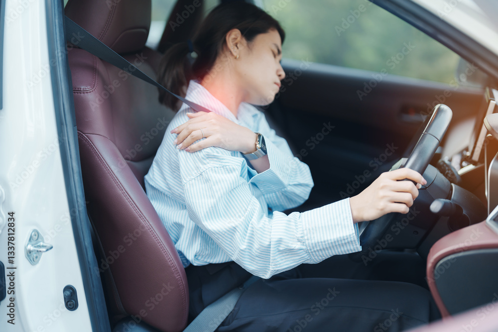 woman with her shoulder and neck sprain while driving car long time ...