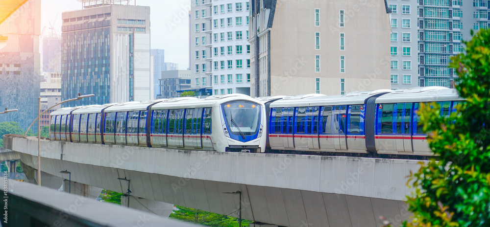 City subway train turns as it passes over city streets. Two subway ...
