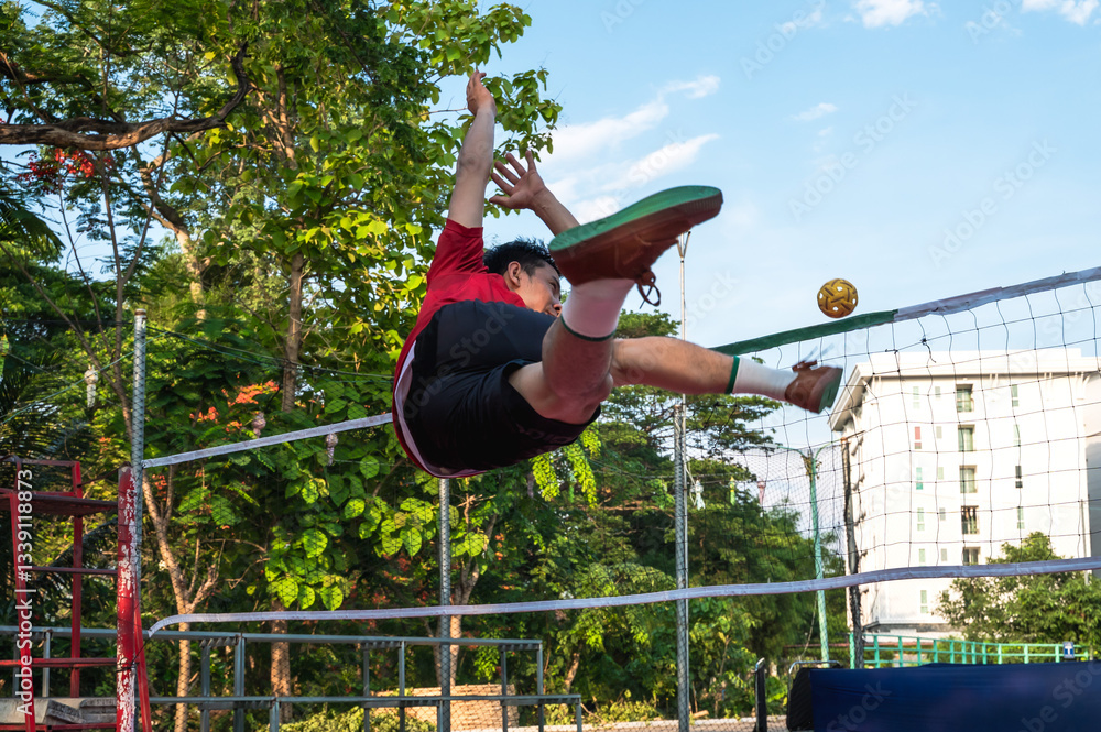 Professional Male Asian Sepak Takraw player shows kicking Sepaktakraw ...