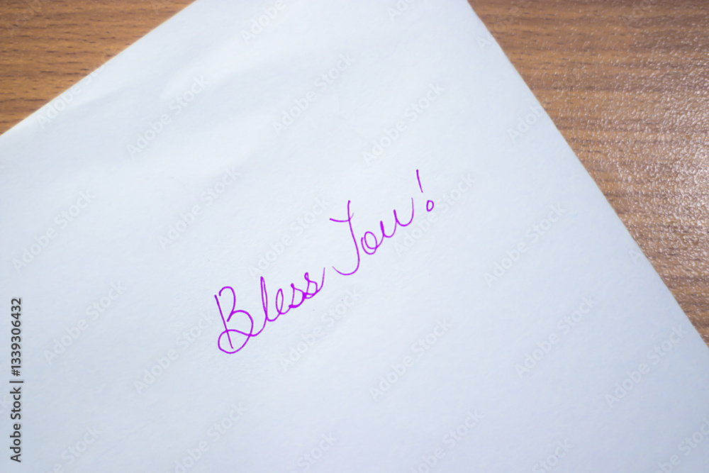 Bless you text handwritten note on whitepaper with wooden texture Stock ...