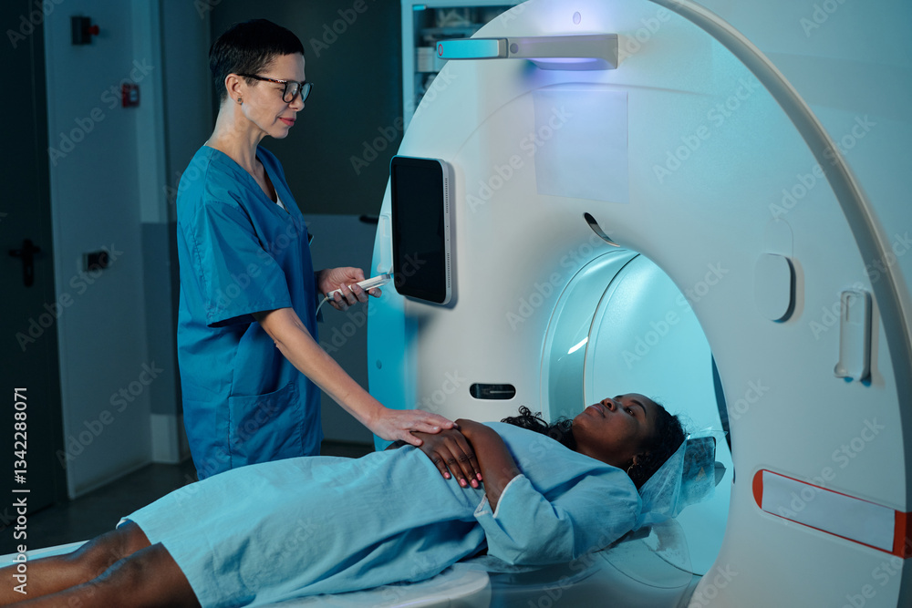 Medical technician conducting MRI scan for patient in hospital setting, ensuring accurate ...