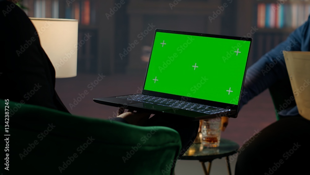 Two secret agents examine case details at CIA safe house with a mockup ...