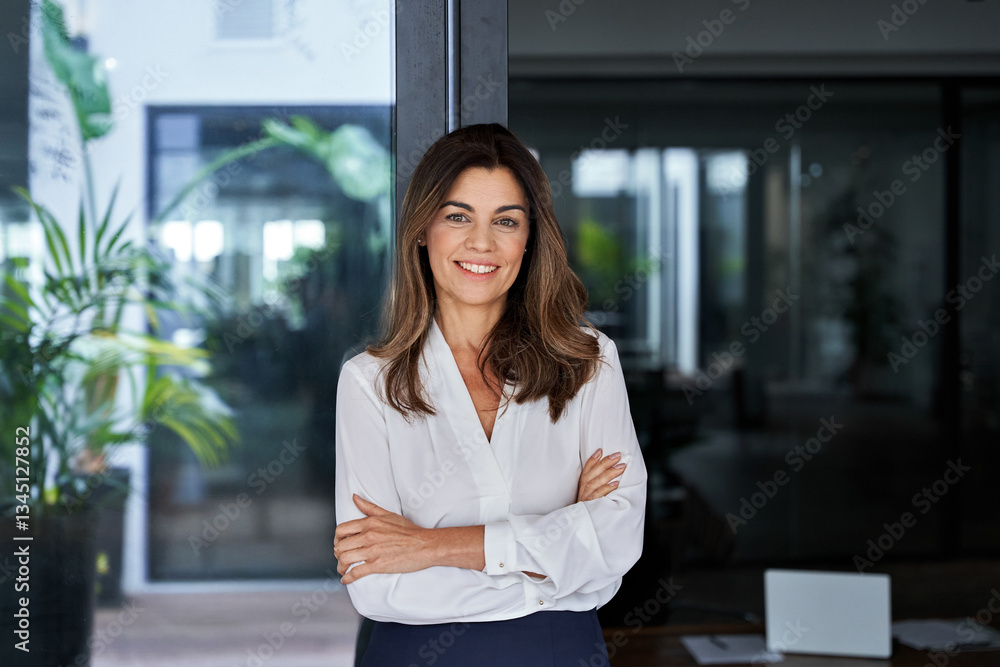 Happy elegant older mature lady posing for portrait standing in office ...