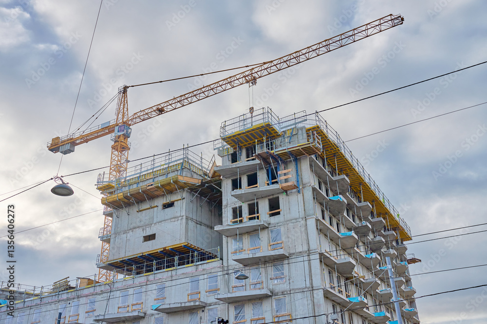 Unfinished concrete multi story building under construction with ...