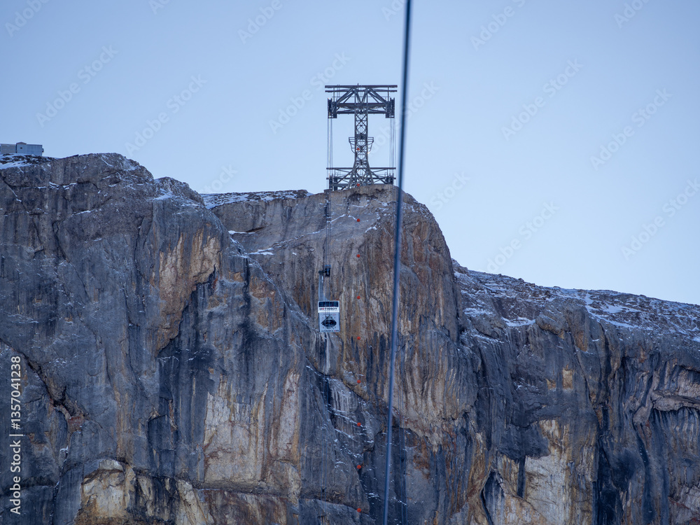 Mountain cable car with passengers to Glacier 3000 summit, featuring ...