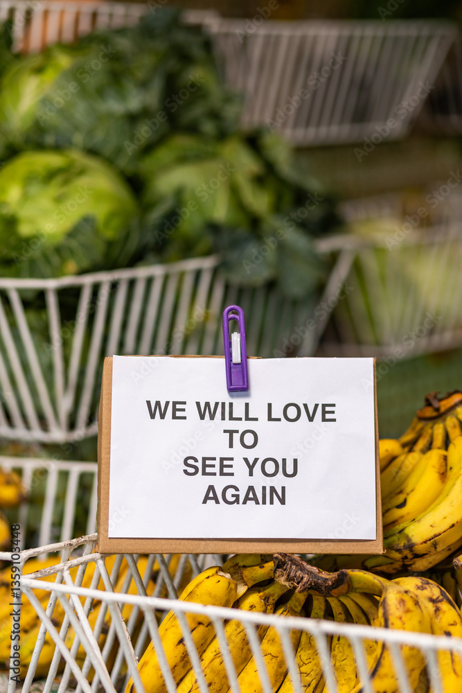 Sign at a grocery store saying "we will love to see you again" telling ...