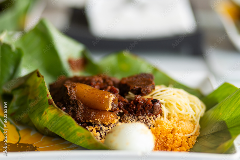 Waakye, local Ghana food made with rice and beans served spaghetti, egg ...