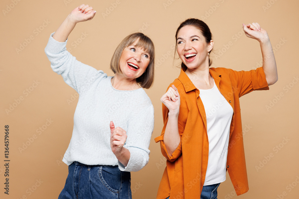 Elder fun parent mom 50s year old with young adult daughter two women ...