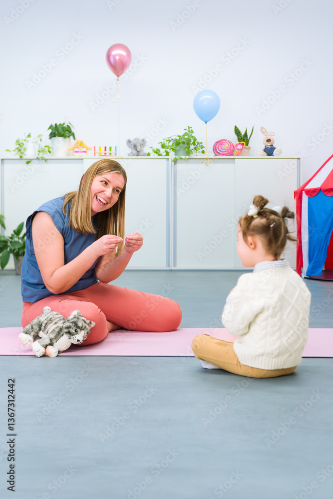 Baby Sign Language. Nonverbal child learning to sign with the help of a ...