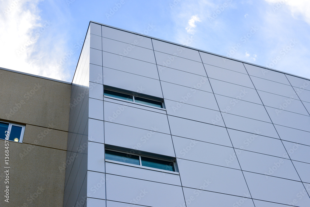 The exterior wall of a contemporary commercial style building with ...