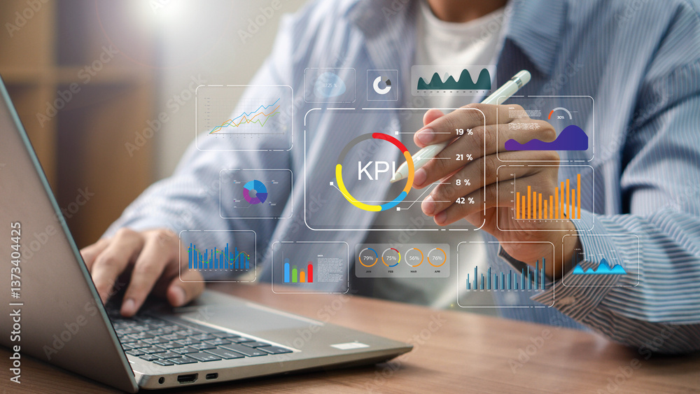 Fotografie Businessman using digital screen to analyze key performance ...