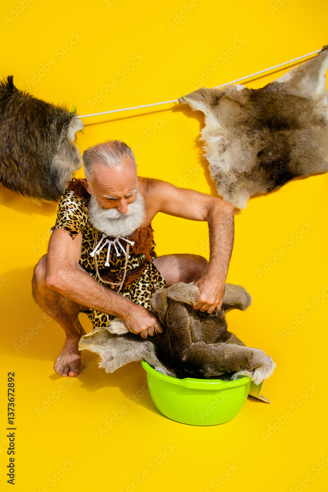 Vertical full length photo of strong paleolitic human wear leopard skin ...