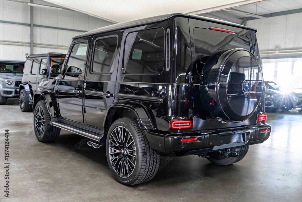 2025 Mercedes-AMG G63 in black with red interior parked in a premium ...