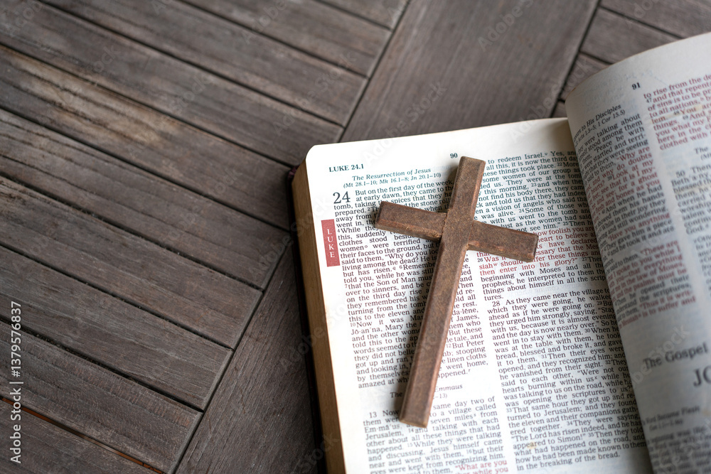 Wooden crucifix cross on top of Luke 24 of the Holy Bible, mentioning ...