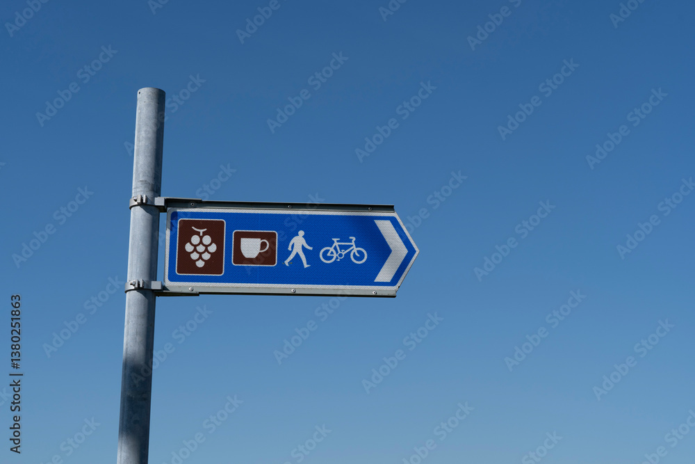 Direction sign with symbols for pedestrians, cycles, refreshments and a ...