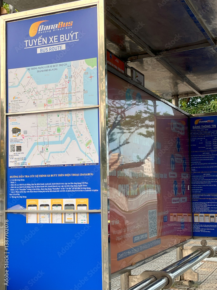 Da nang, Vietnam - April, 06, 2025:A bus stop shelter displays a blue ...